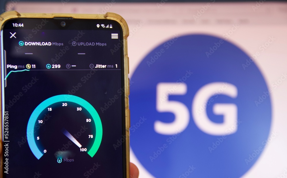 5G - network speed concept. Man checking his smartphone on network and ...