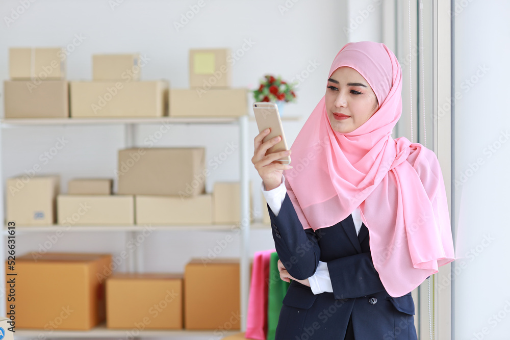 Religious asian woman in blue muslim suit and pink shaft on head ...