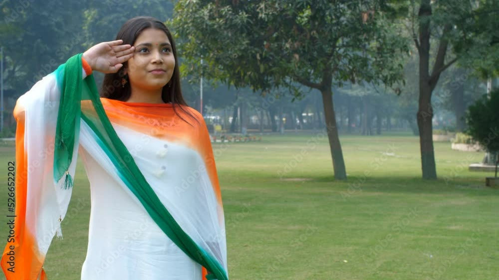 A beautiful teenage girl saluting the Indian flag on the occasion of ...