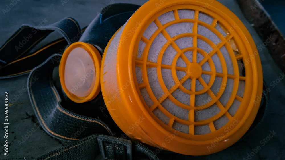 dusty respirator mask on the table, NH3 to control and fix leaks inside ...