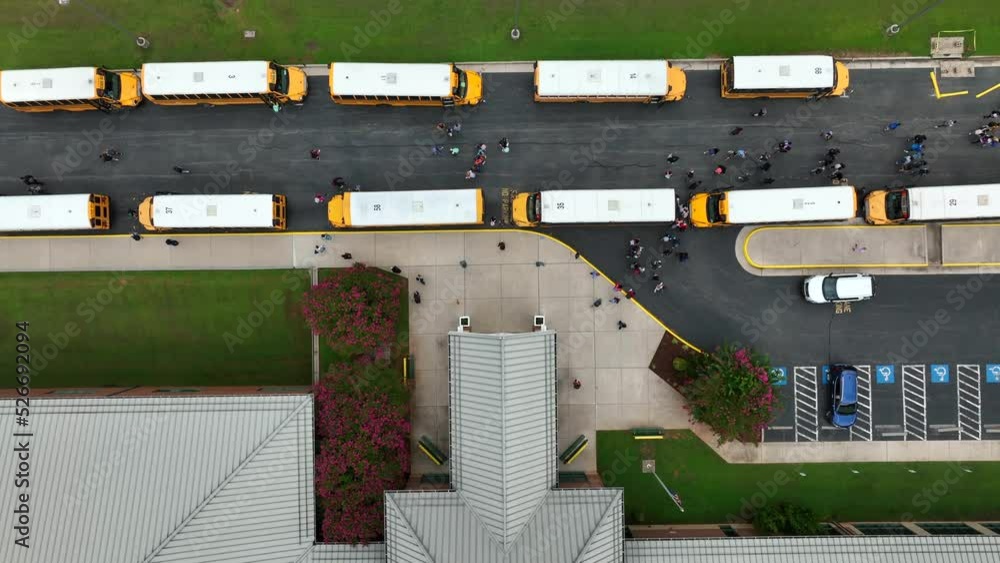 Students exit school building to bus. Top down aerial. Stock Video ...