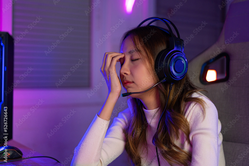 Eyes tired. Gamer and E-Sport online of Asian woman playing online ...