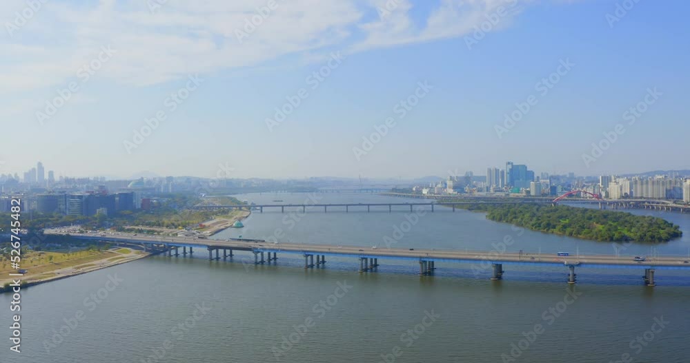 Drone shot traveling backward above the Han river from the Mapo bridge ...