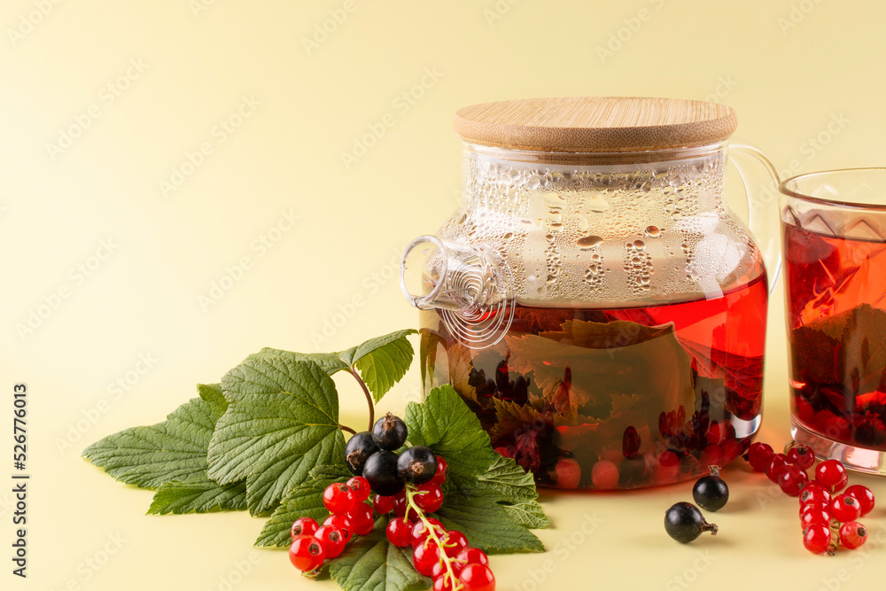 Tea made from berries and leaves of black and red currants in a ...