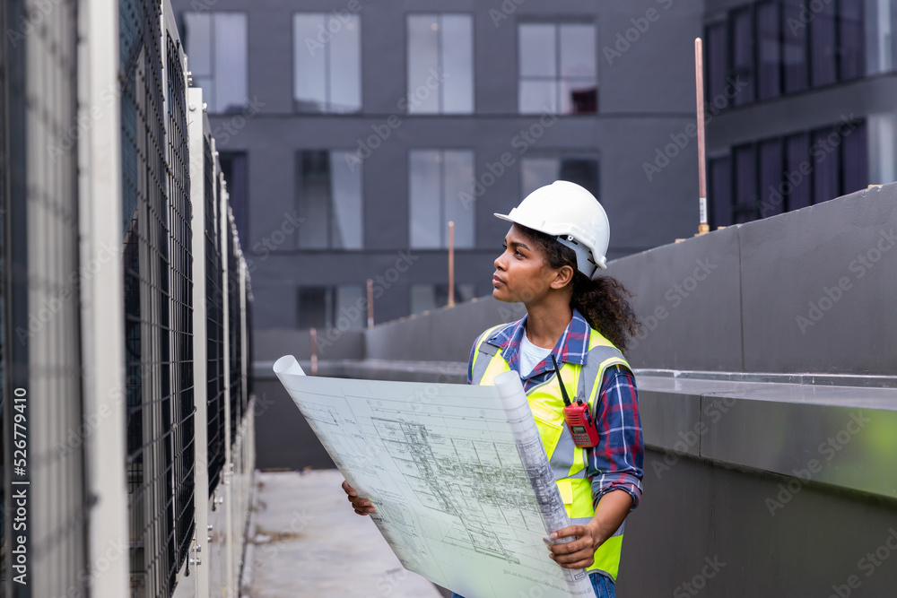 Engineers with draft plan of building on constructing site. Engineer ...
