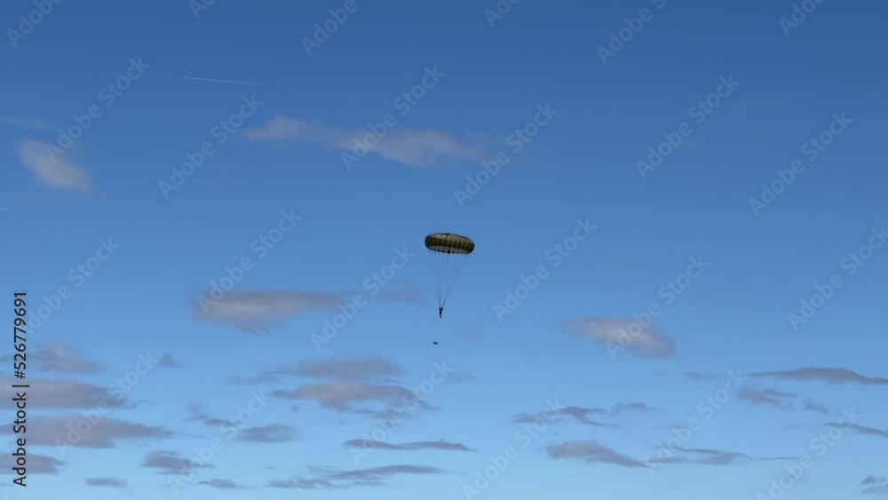 army paratrooper (3 PARA) parachuting in overhead assault mode, wearing ...