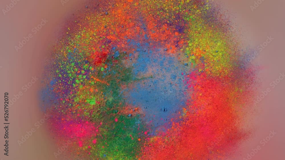 Sprinkle several colors of dust on the white paper that is spinning ...