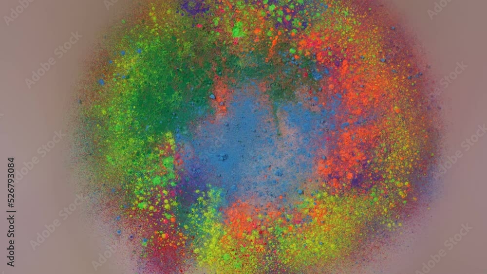 Sprinkle several colors of dust on the white paper that is spinning ...