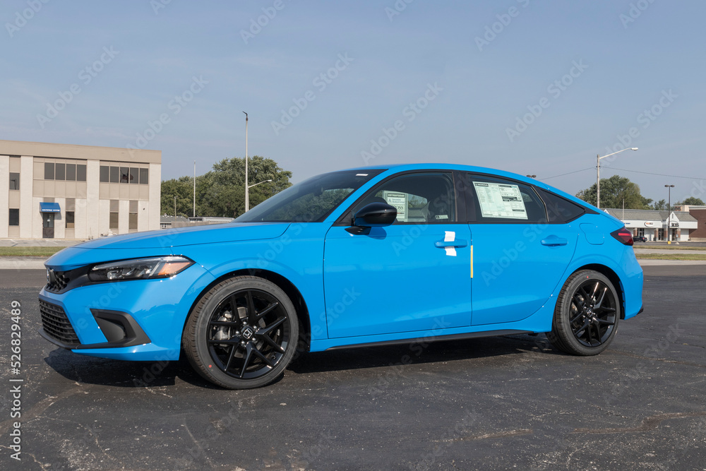 Honda Civic Hatchback display at a dealership. Honda offers the Civic ...