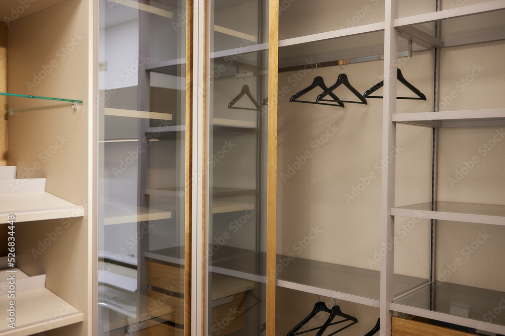 Walk in closet interior. Modern interior, beautiful wardrobe without ...