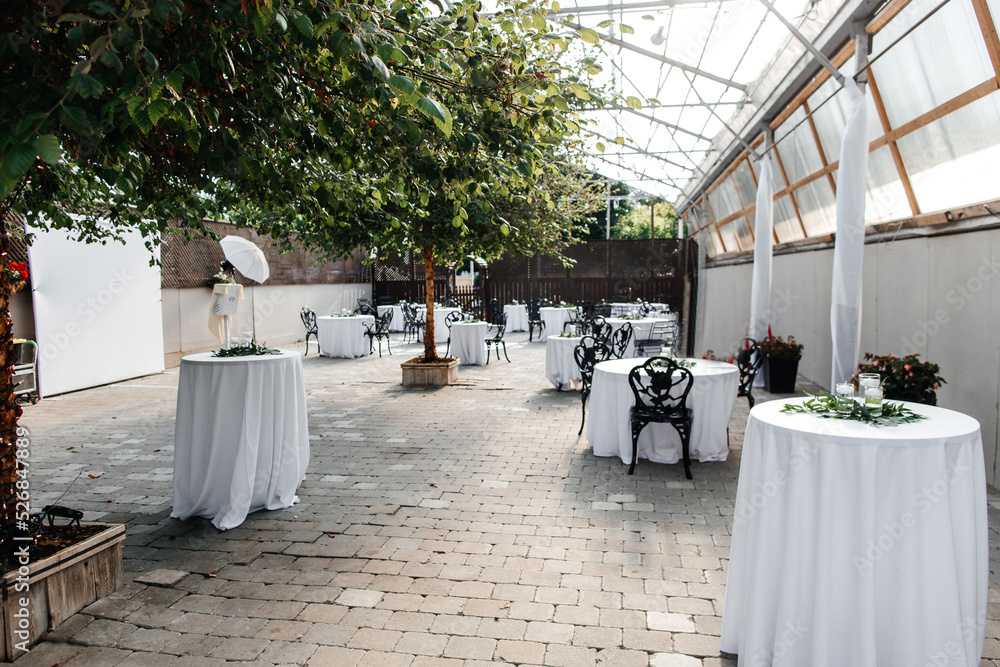 The restaurant is in a beautiful location with decorated tables and ...