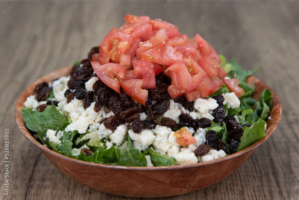 Bleu cheese and walnut salad is delicately balanced tall with chopped ...