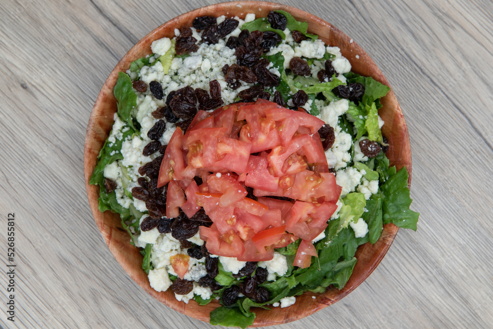 Overhead view of bleu cheese and walnut salad is delicately balanced ...