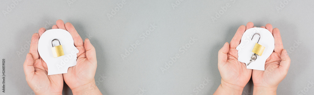 Silhouette of two people, one man is closed minded with a lock in his ...