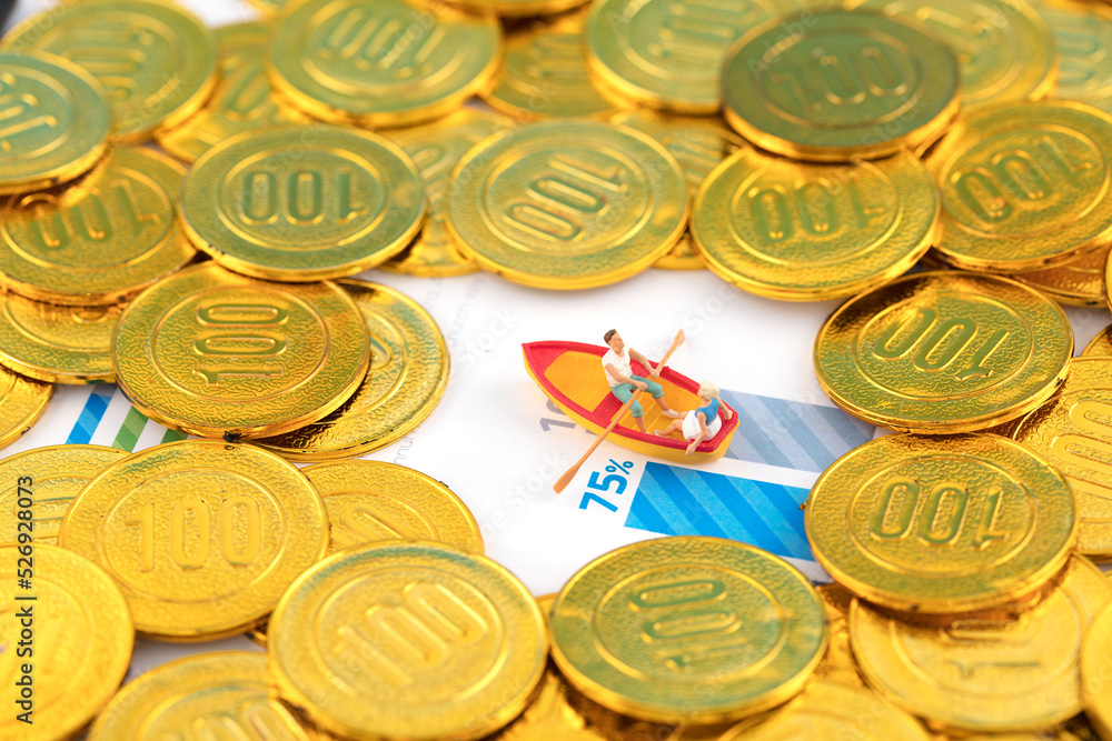 Cruise ship in the middle of a lot of gold coins in miniature Stock ...