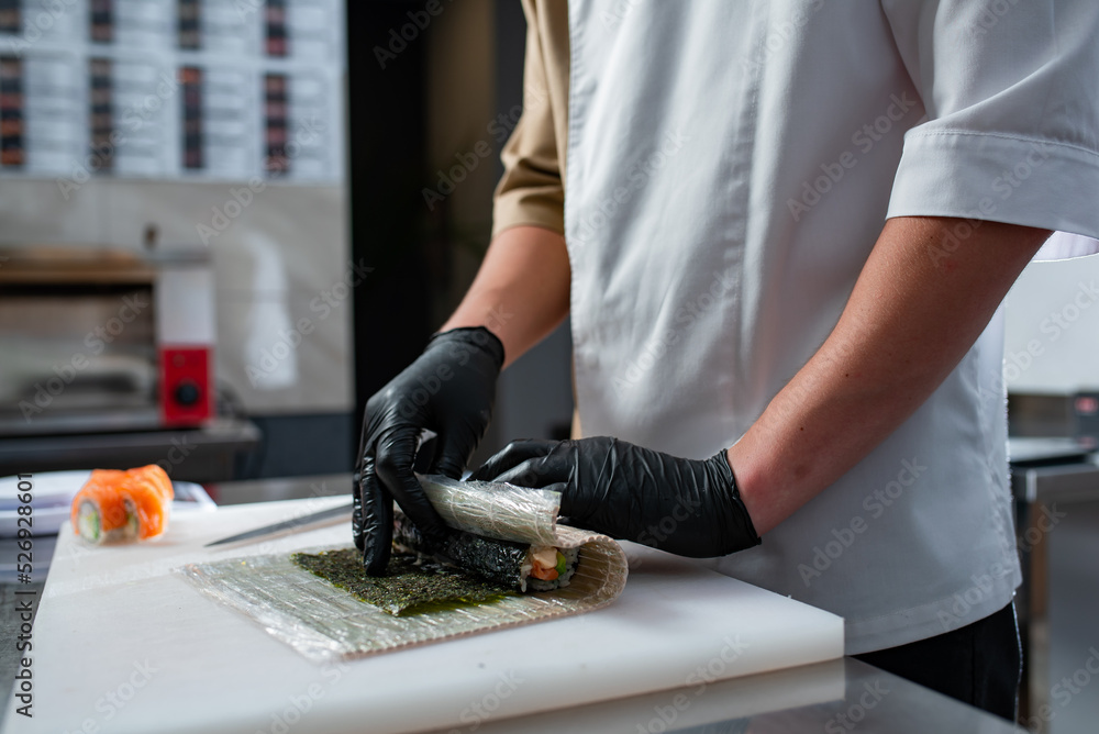 chef cooking sushi rolls Stock Photo | Adobe Stock