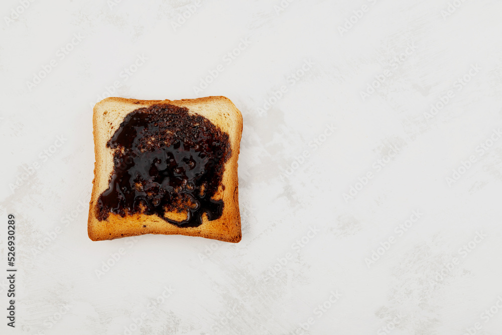 One toast for breakfast on grey textured surface, top view. Roasted ...