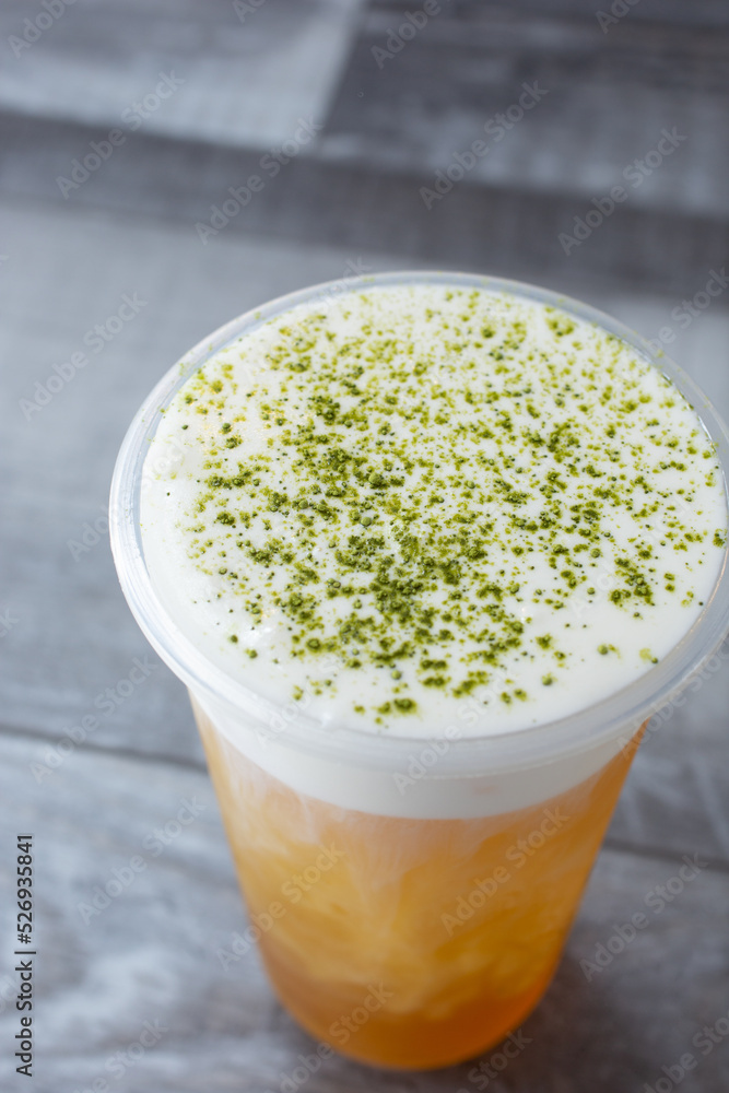 A view of a layered milk tea beverage. Stock Photo | Adobe Stock
