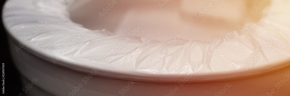 disposable cover pad on the rim of the toilet seat. wc hygiene system ...