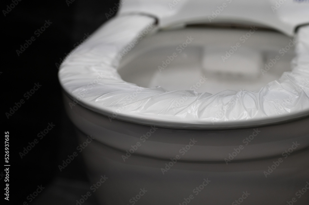 disposable cover pad on the rim of the toilet seat. wc hygiene system ...