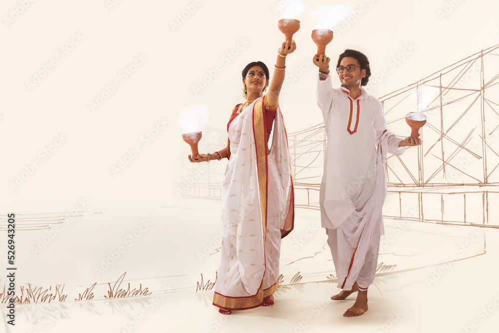 Bengali couple performing dhunuchi dance on the occasion of Durga Puja ...