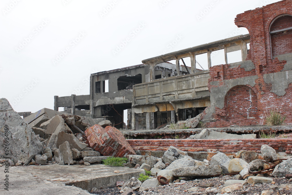 Battleship Island destroyed buildings. Red bricks building with ...