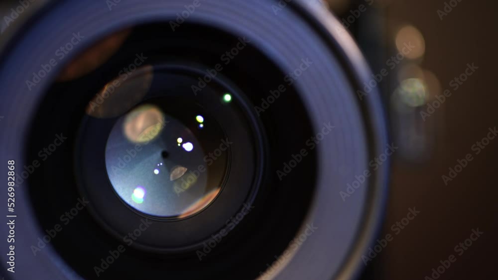Close-up of opening and closing the aperture on a photographic lens ...