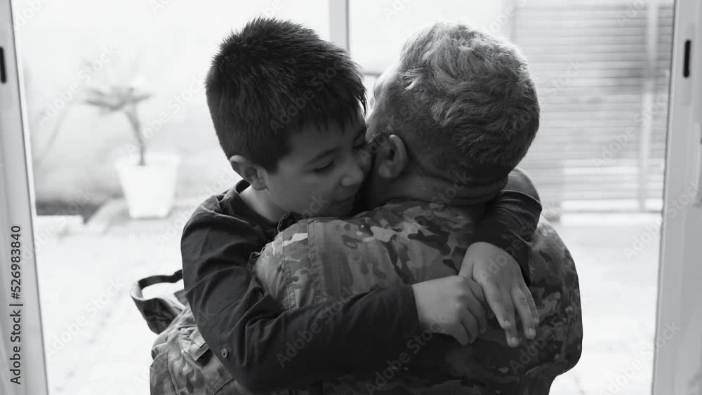 Military soldier man hugging his son at home - Father and child love ...