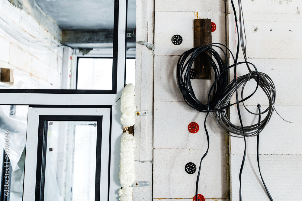 Insulation of doorways and installation of electrical wiring in the ...