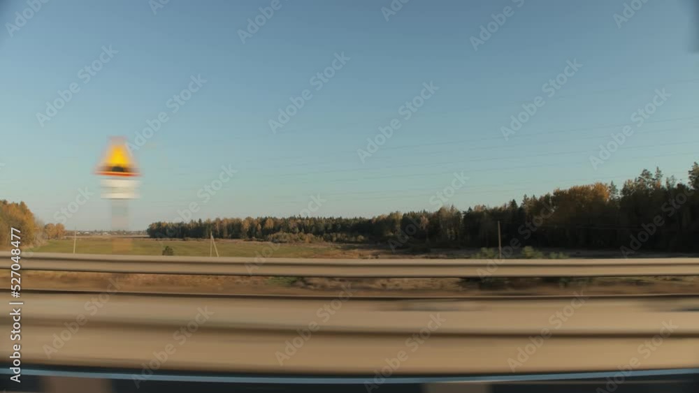 Ascent to bridge of road interchange ramp viaduct. Riding along traffic ...