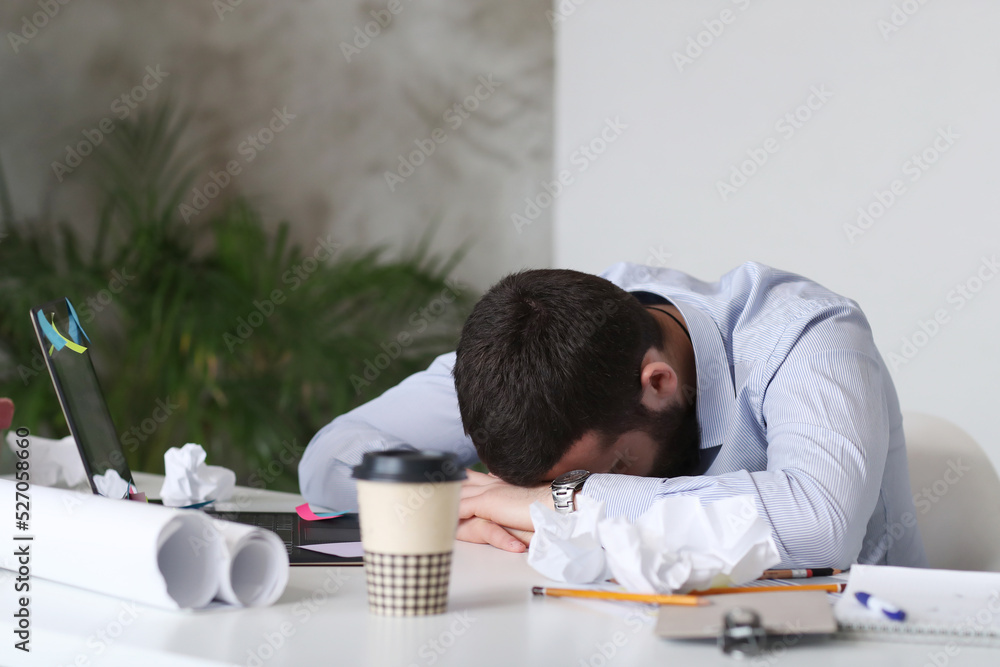 The Struggle for Success: Businessman's Fatigue Evident as He Pushes ...