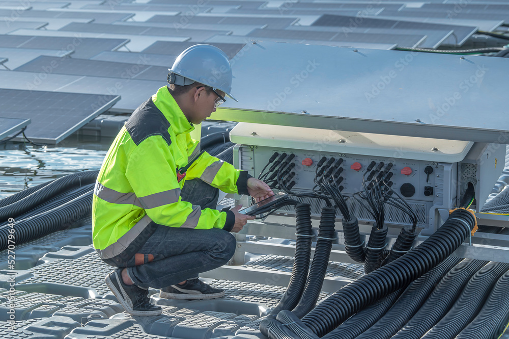 Asian engineer working at Floating solar power plant,Renewable energy ...