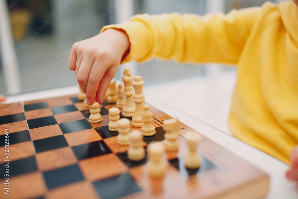 Little kids playing chess at kindergarten or elementary school. Hand ...