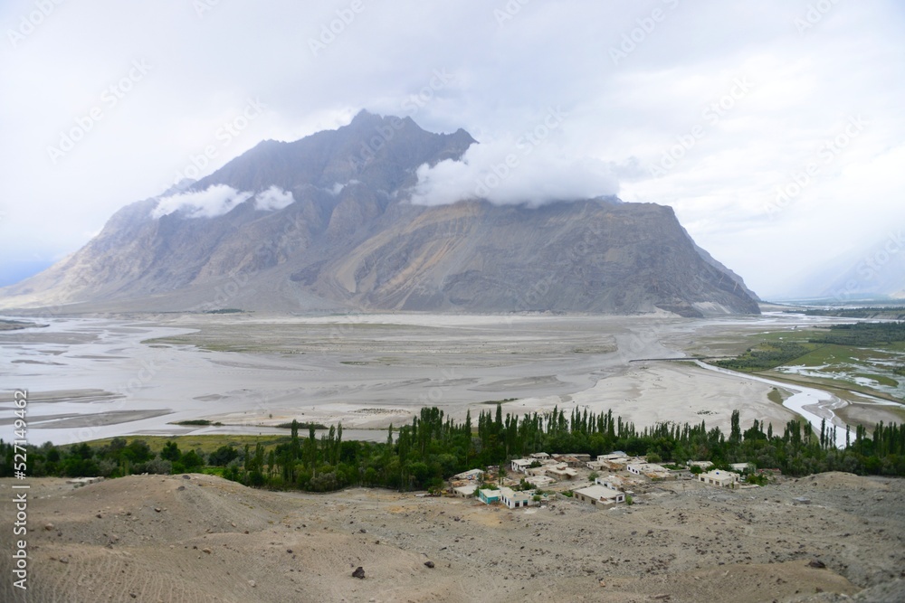 Clouds over mountains around Skardu city and a wide section of Indus ...