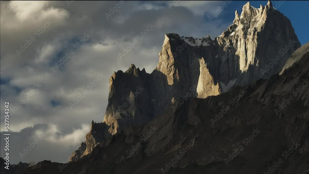 Untitled ProjectDrone pans left revealing sharp rocky mountain peaks in the Himalayas, shot ...