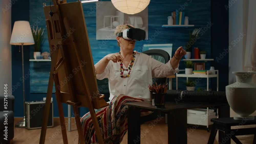 Senior artist using vr glasses with augmented reality to draw vase and ...