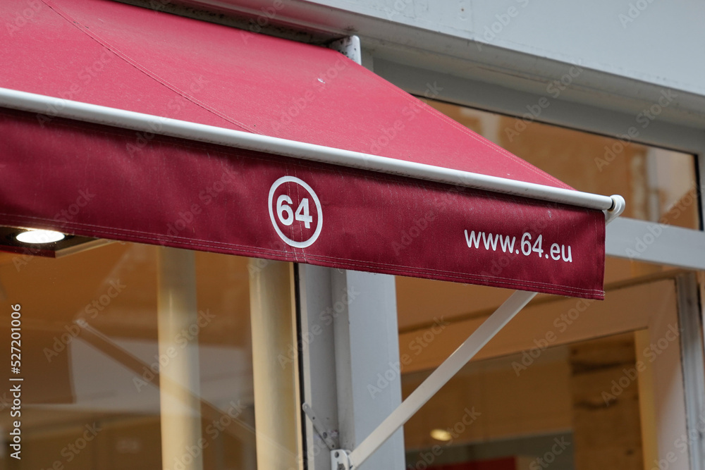 64 sign logo number and brand text on store facade clothing shop ...