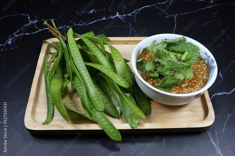 Pile of fresh river tamarind (Leucaena leucocephala) serving with spicy ...