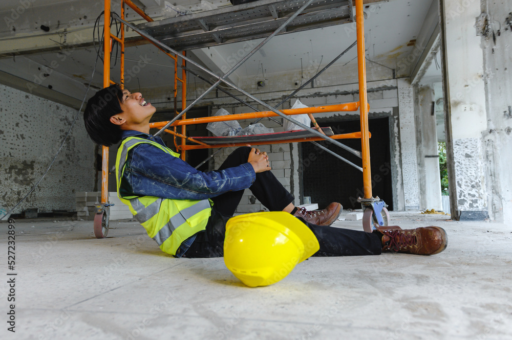 Knee accident at work of construction worker at site. Builder accident ...