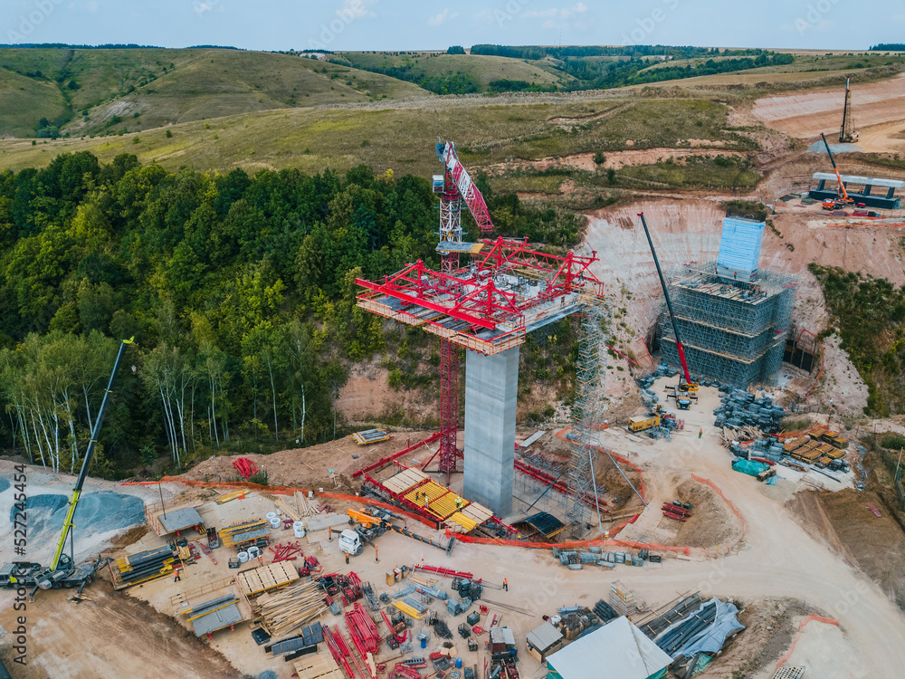 Constructing concrete pillars of the bridge. Construction of the new ...