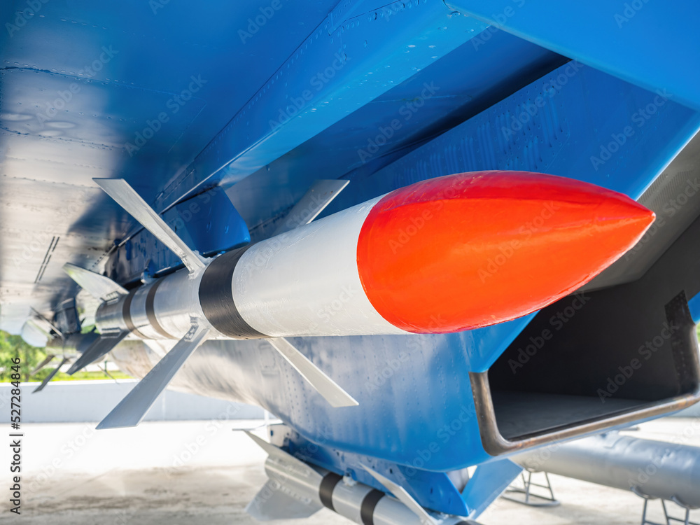Rocket under wing of aircraft. Air-to-Earth missile close-up. Rocket to ...