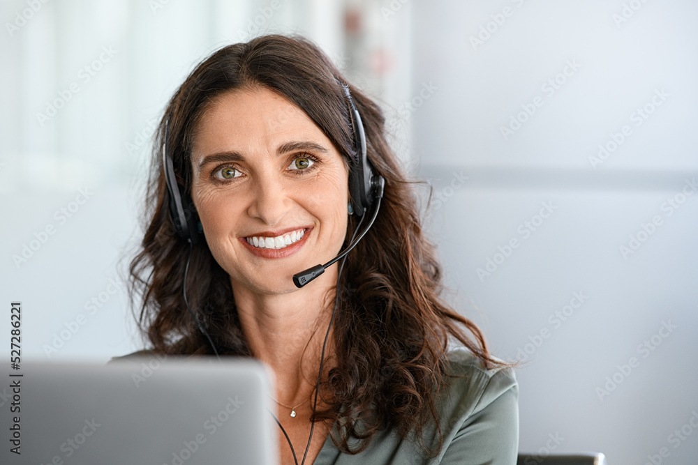 Mature happy woman working on phone call Stock Photo | Adobe Stock