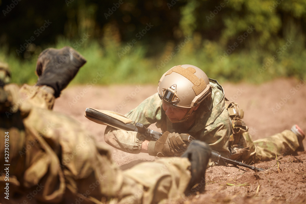 Special forces soldier with weapon take part in military maneuver. War ...