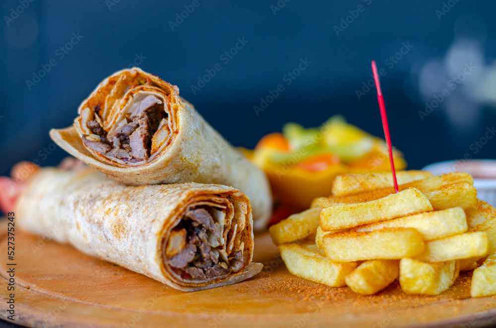 Doner kebab wrap in lavash bread. Traditional Turkish cuisine doner ...