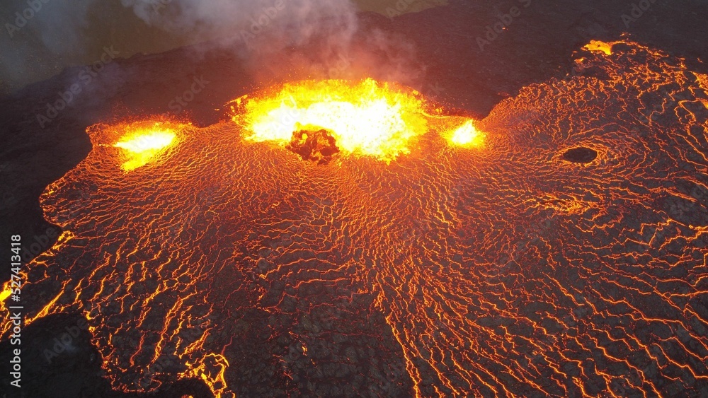 Aerial view of the Fagradalsfiall volcano eruption and hot lava on land ...