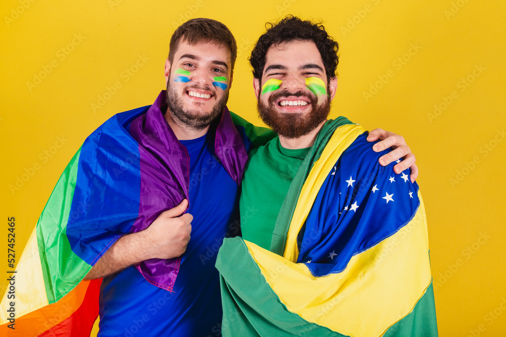 couple of men, brazilian, soccer fans from brazil, wearing LGBT flag ...