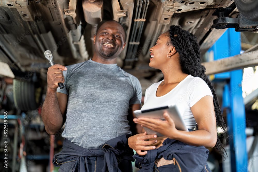 Mechanical girl wearing half overall cover suit hold checklist talking ...