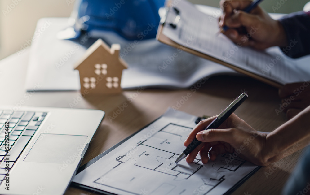 Architect & Engineer working drawing document about project planning ...