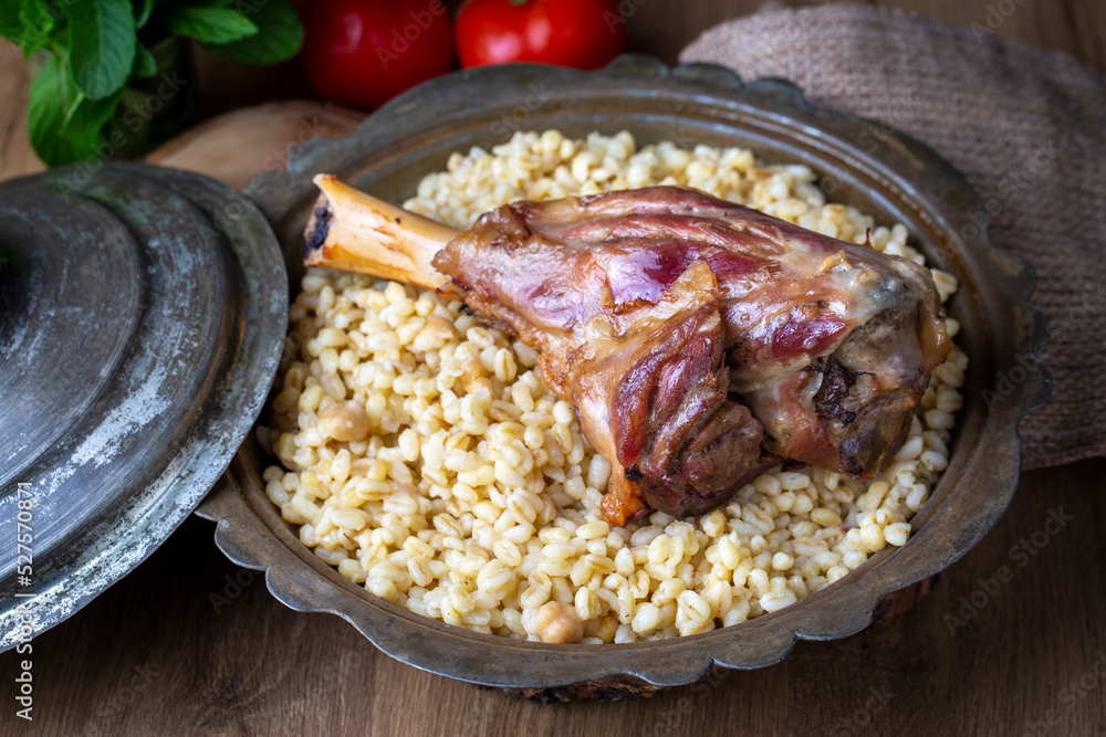 Turkish foods; lamb shank tandoori on bulgur wheat rice (Turkish name ...