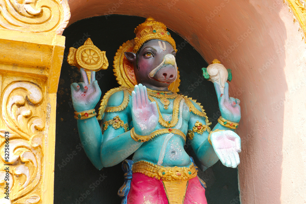 Statue of God Varaha on the wall of a Hindu temple in India. Varahadev ...